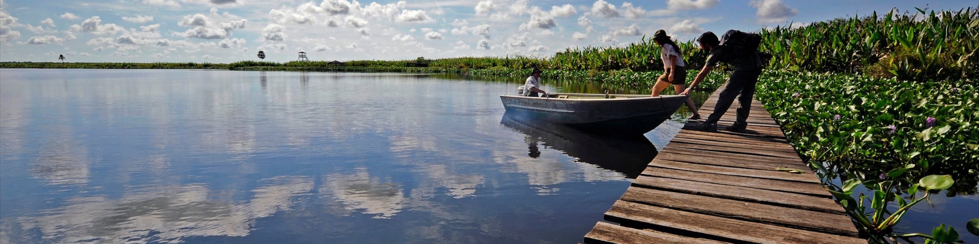 Formosa which includes boating and a river or creek as well as a small group of people