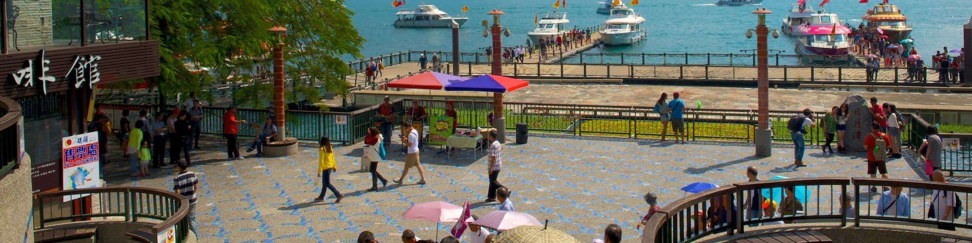 Shueishe Pier which includes a lake or waterhole as well as a small group of people