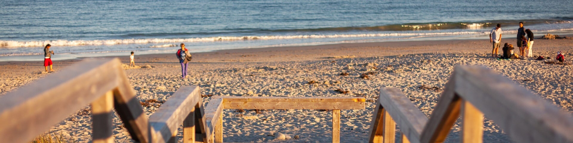 Crystal Crescent Beach which includes a sandy beach, general coastal views and a sunset