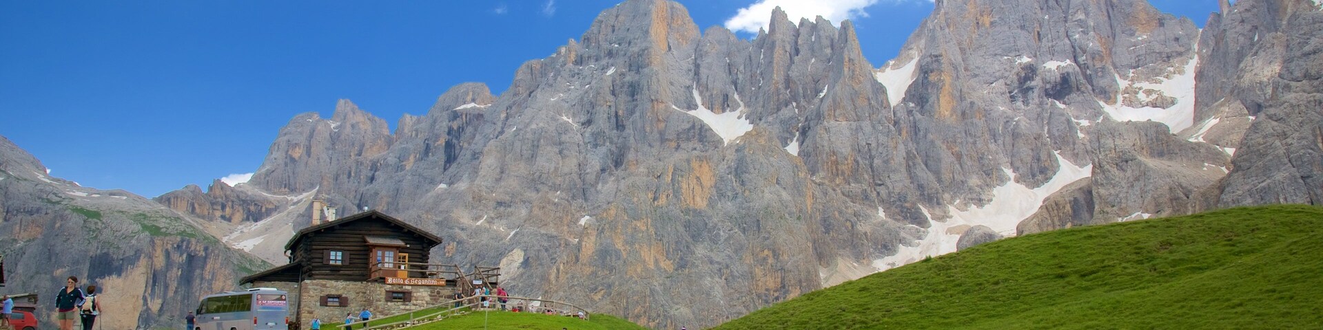 Passo Rolle showing mountains and a lake or waterhole