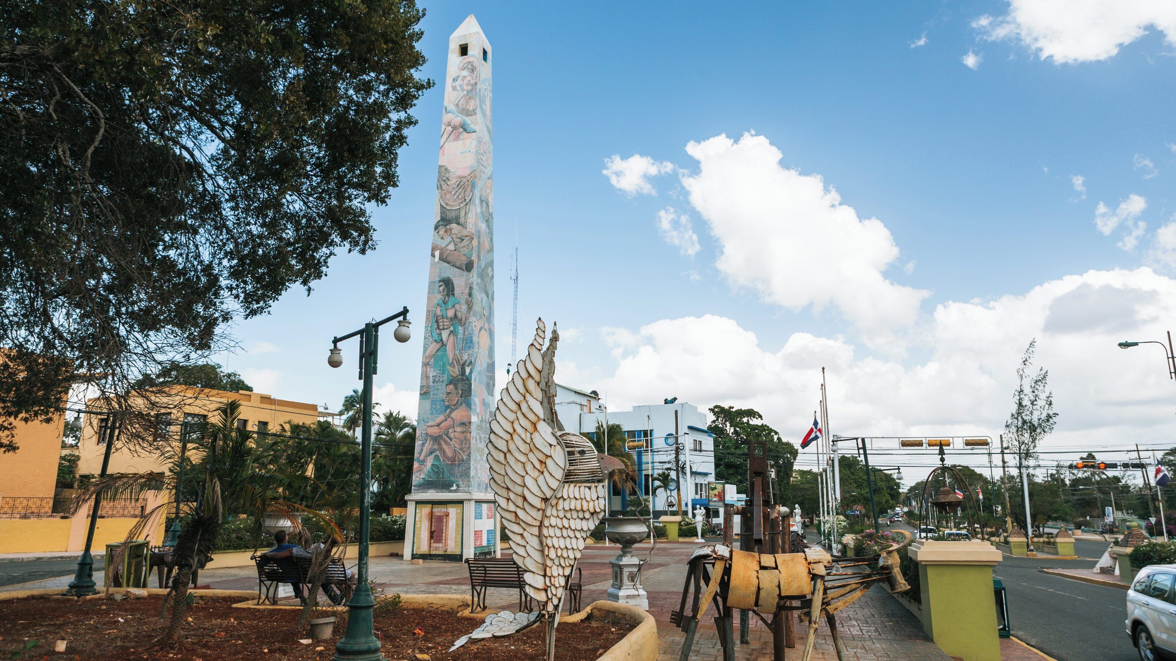 Visit El Obelisco in Punta Cana, La Romana, Dominican Republic, a historic landmark surrounded by local culture and beautiful architecture