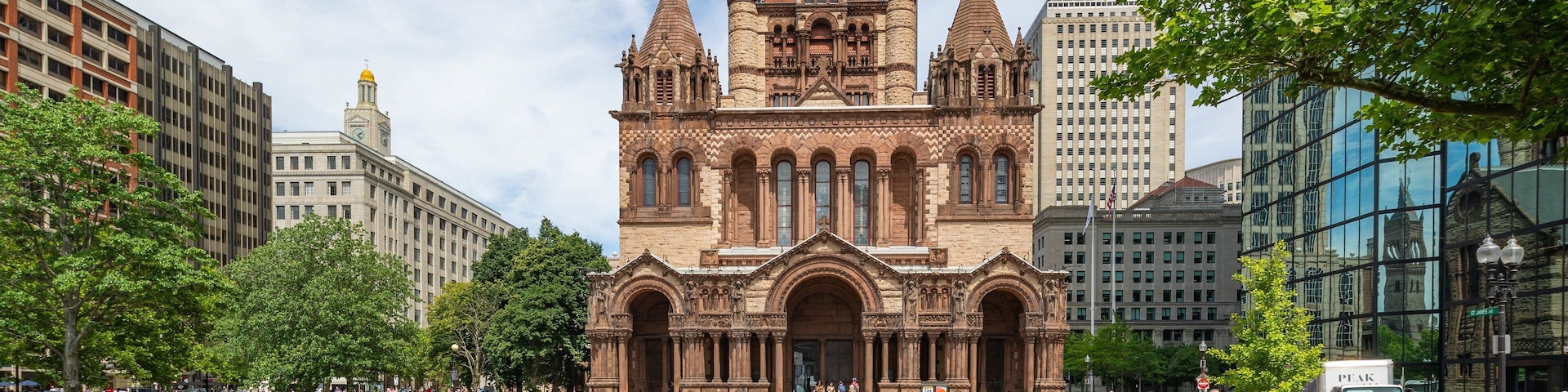 Trinity Church Boston showing heritage architecture, a city and a garden