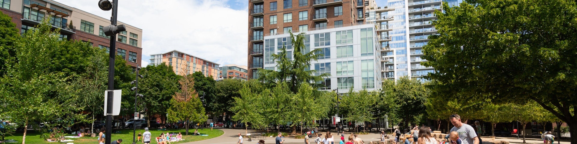 Jamison Square which includes a park as well as a small group of people