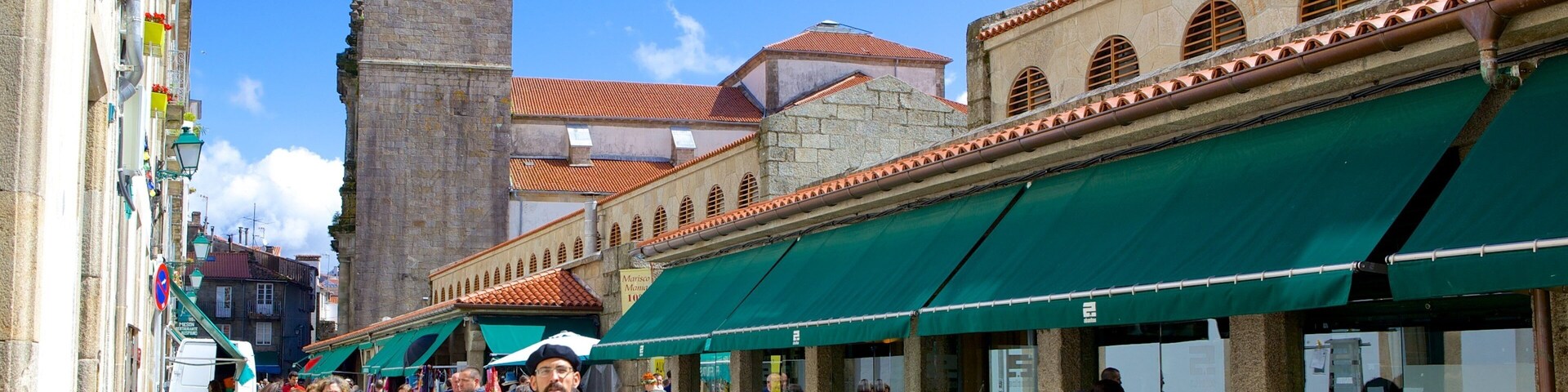 Mercado de Abastos de Santiago featuring markets, street scenes and cafe lifestyle