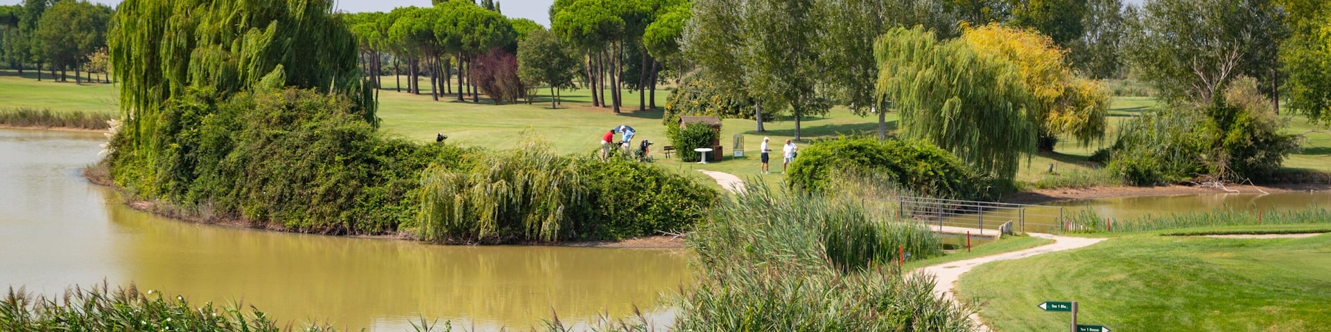 Adriatic Golf Club Cervia featuring a pond and golf