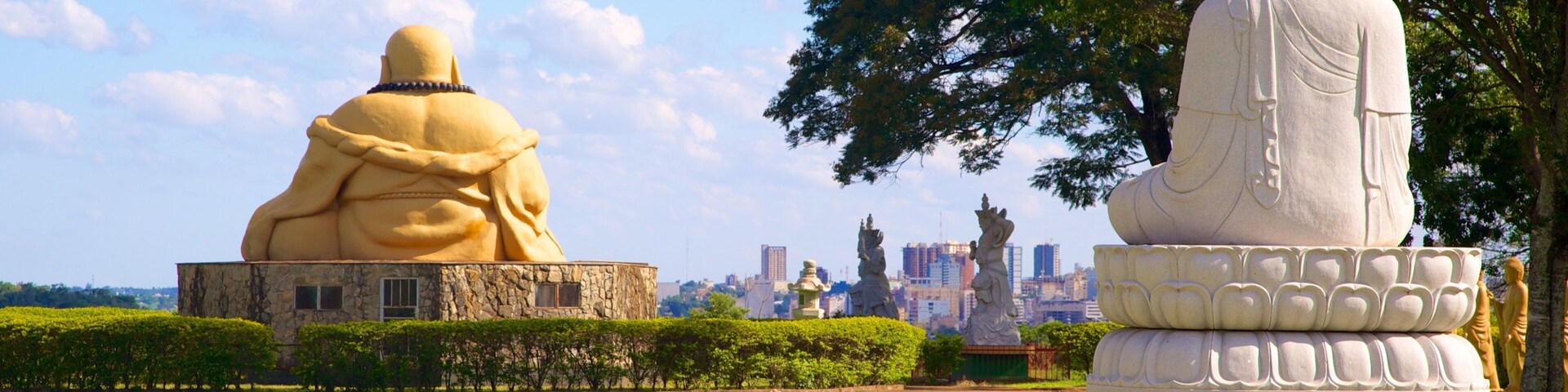 Buddhist Temple featuring a temple or place of worship, religious elements and a statue or sculpture