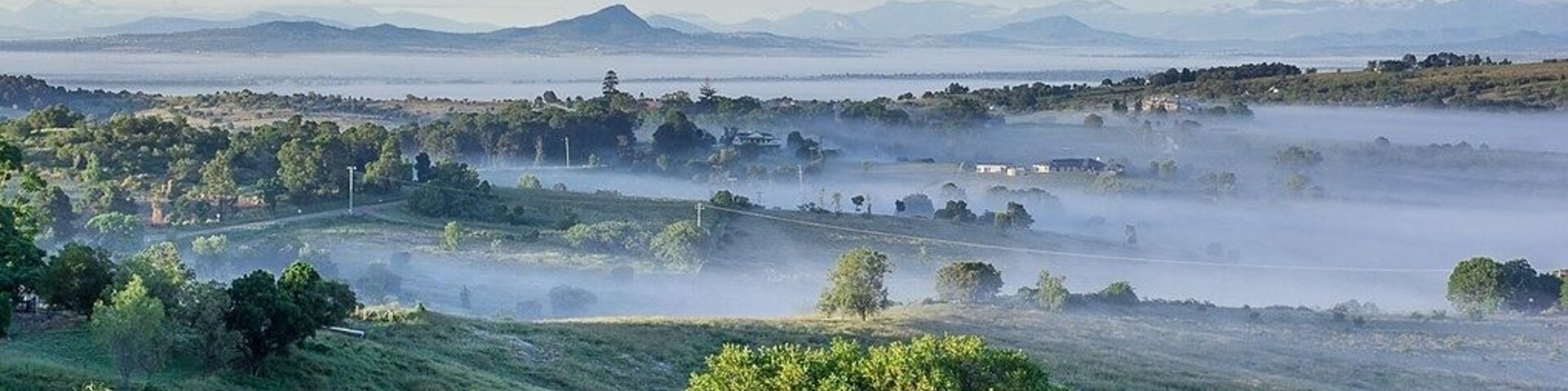 Early morning mist across the valley taken from mountain view drive just off the warrigo highway looking across to Hatton vale Queensland.