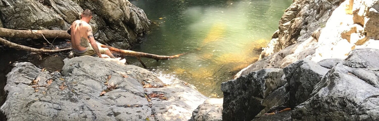 Great swimming hole and a decent height to jump off if you into that. You have to climb down the embankment and walk up the creek to find this one