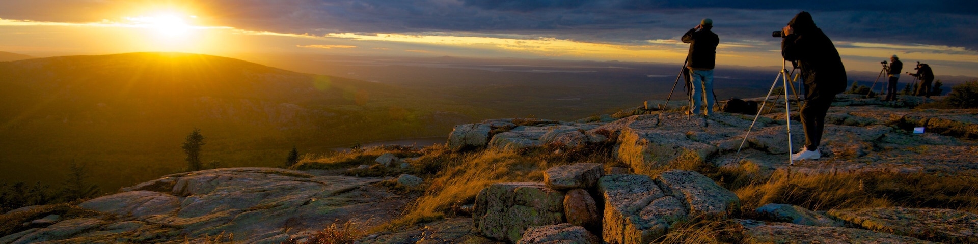 Cadillac Mountain which includes a sunset, landscape views and mountains