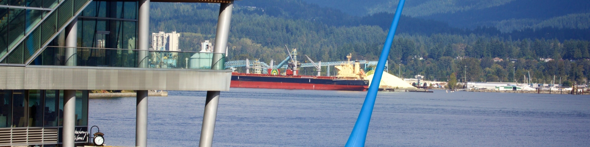 Vancouver Waterfront which includes a bay or harbor and outdoor art