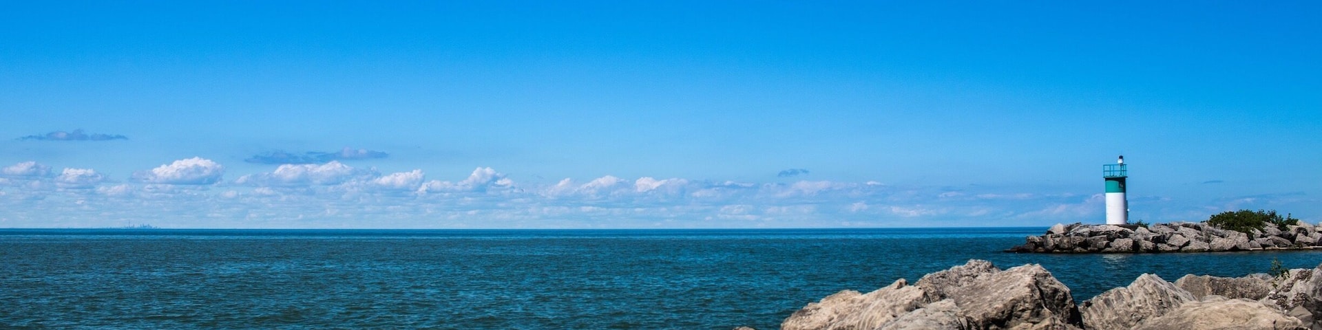 Views of Lake Ontario which Ontario comes from an Iroquois word meaning “beautiful lake”.  Not pictured here but to the right of the shot is La Grande Hermine it is a replica of one of the 3 ships that Jacques Cartier used when exploring and the St. Lawrence river back in 1535. A side show attraction since it is half submerged due to arson in 2003. #bvsblue photo contest #lakeontario