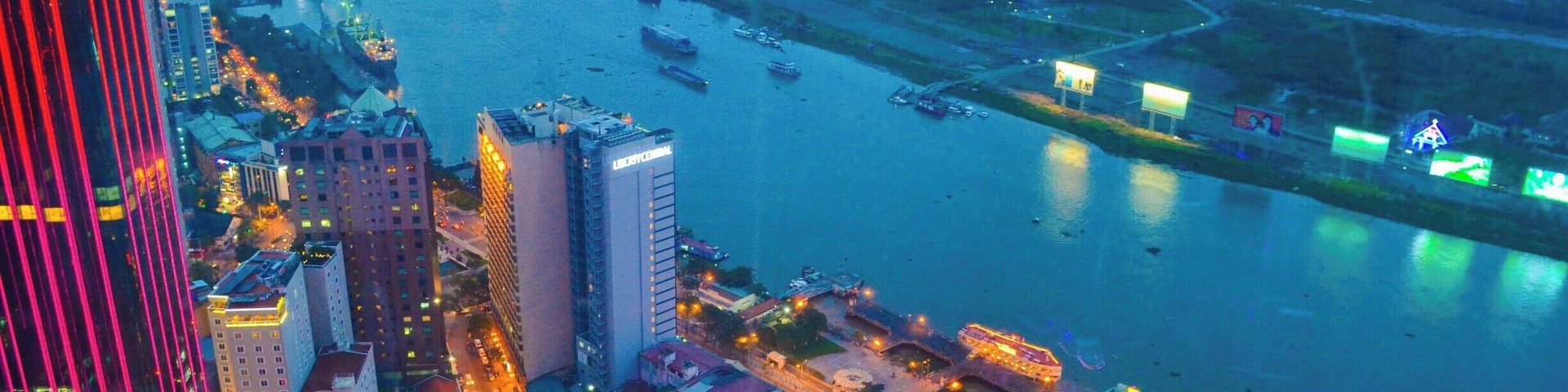 #TroveOn: EON Heli Bar located at the 51st floor of Bitexco Financial Tower overlooks the glittering city of Saigon.
After a tiring day of roaming the streets of Cho Lon, Saigon's Chinatown, my friend and I headed to the swanky part of the city to grab a drink at a bar (basically we just wanted to get some shots of the skyline and technically just paid to get shots of it) as part of our 23rd birthday celebration.
EON Heli Bar is a great vantage point to get shots of the skyline.
Seen here is the Saigonese skyline succumbing to the night.
