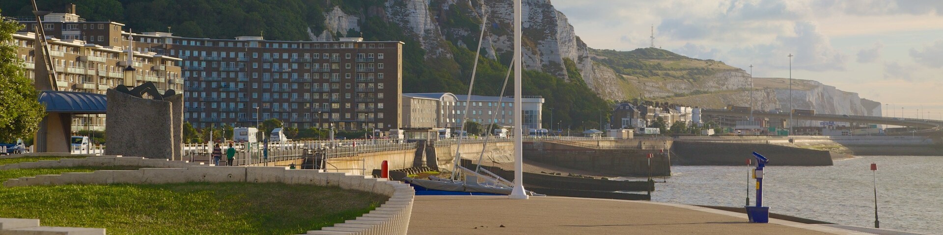 Dover Beach which includes mountains, a sandy beach and a coastal town