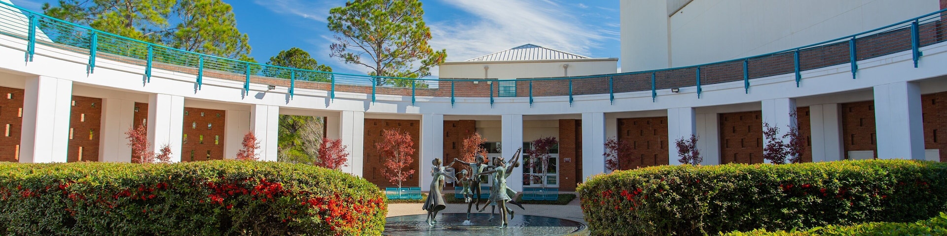 Northwest Florida State College showing a fountain, a statue or sculpture and a garden