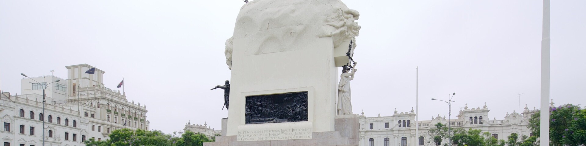 Plaza San Martin featuring a monument, a statue or sculpture and flowers