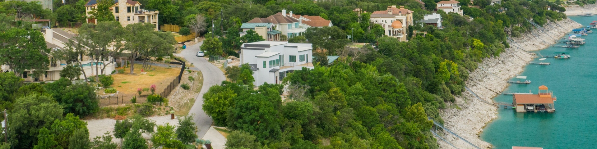 Lake Travis which includes general coastal views, landscape views and a coastal town