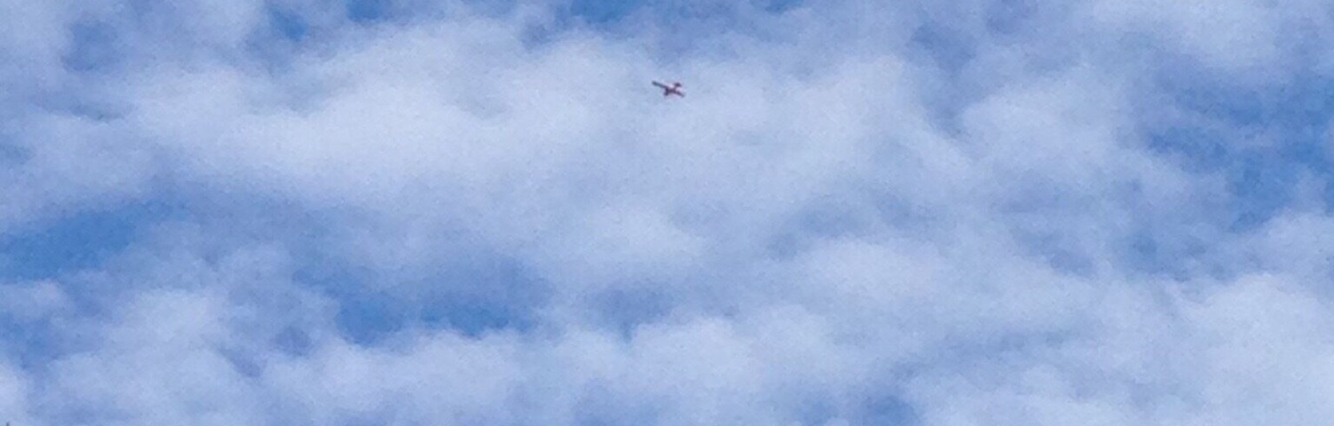 Cloudy Sky and a small red aereoplane during winter time #italy #sky