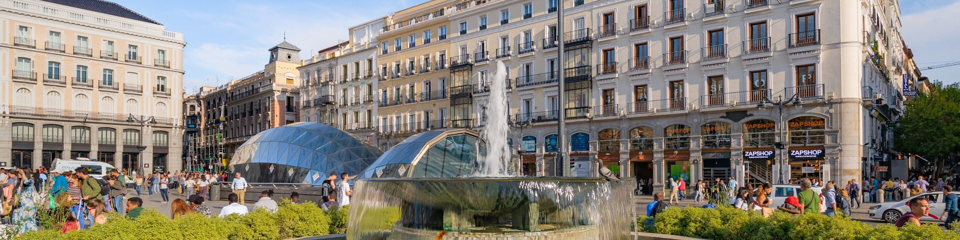 Puerta del Sol which includes a city and a fountain