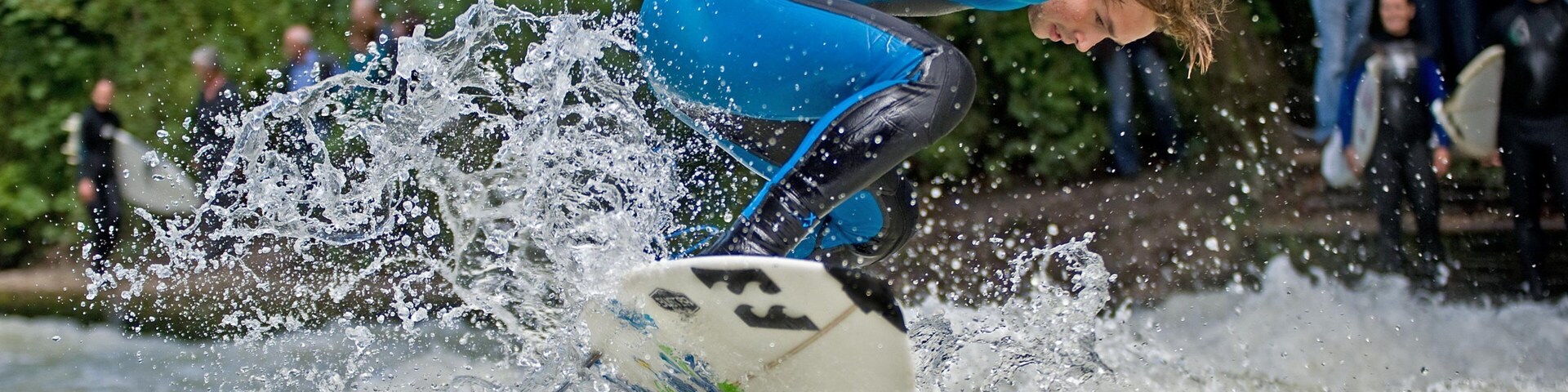 Eisbach Surfing which includes waves and surfing as well as an individual male