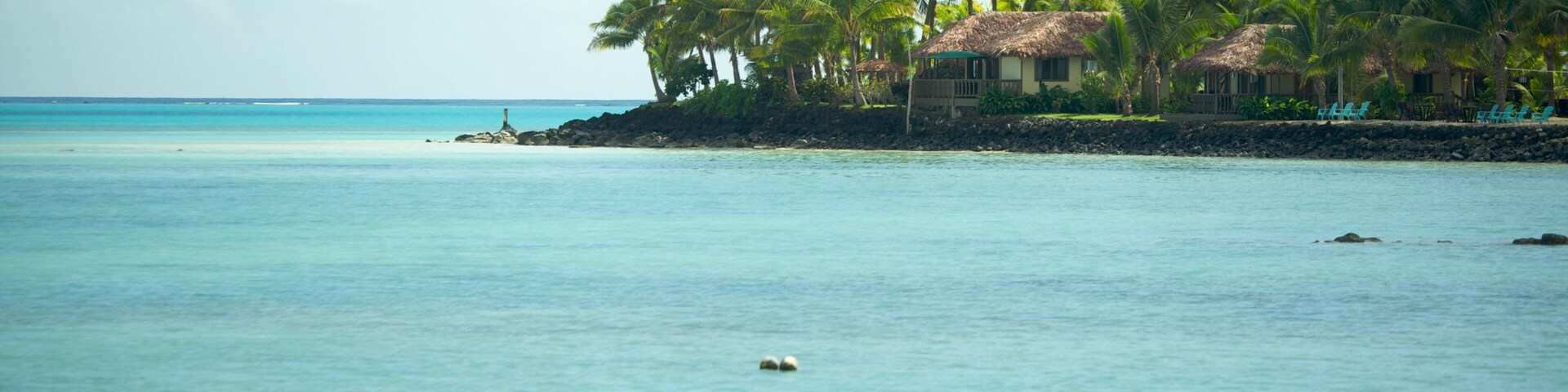 Manono featuring a house, rocky coastline and tropical scenes