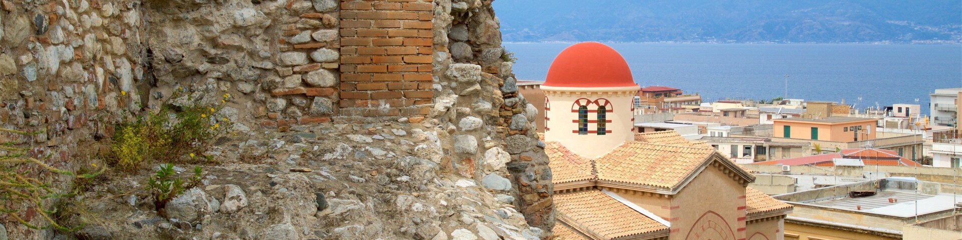 Aragonese Castle featuring a coastal town and heritage elements