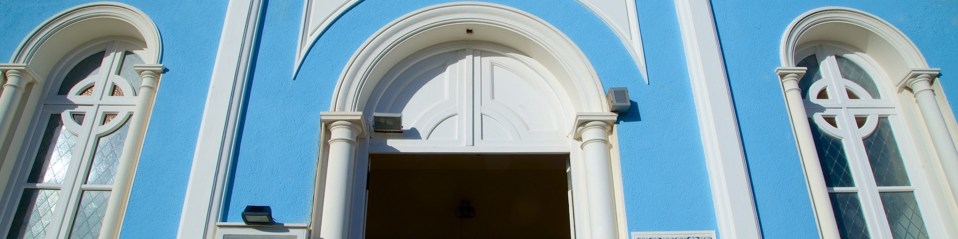 Candelaria Church which includes signage, heritage architecture and a church or cathedral