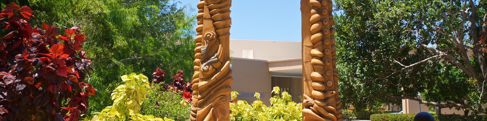 Coral Springs Museum of Art featuring outdoor art and a park