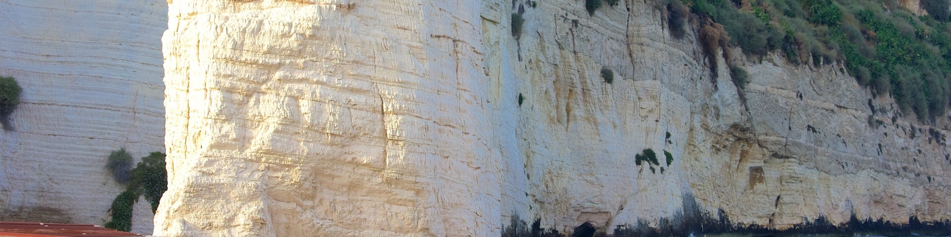 Pizzomuou featuring a sandy beach and rocky coastline