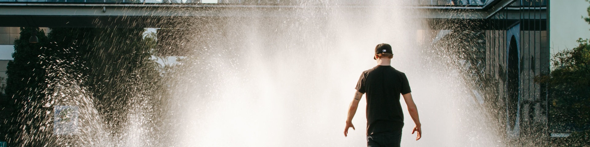 Salmon Street Springs which includes a fountain as well as an individual male