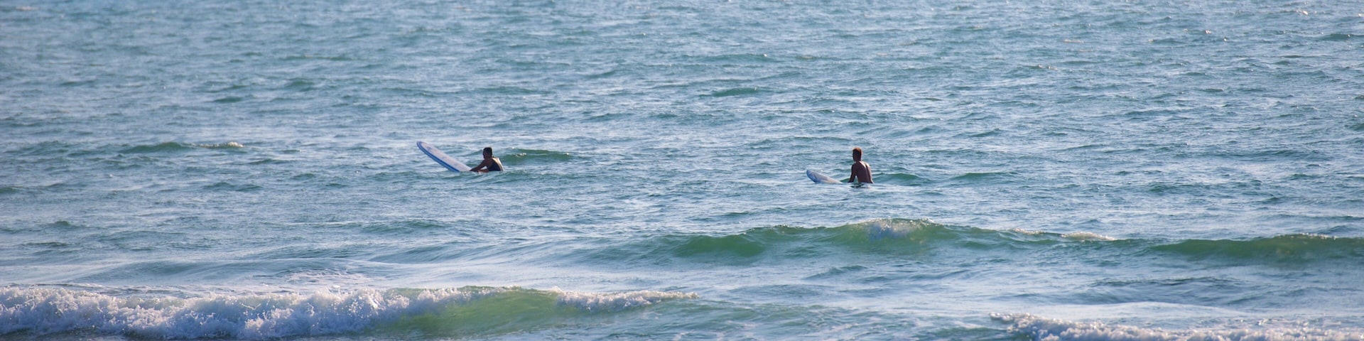 Cijin Seaside Park featuring a sandy beach and waves