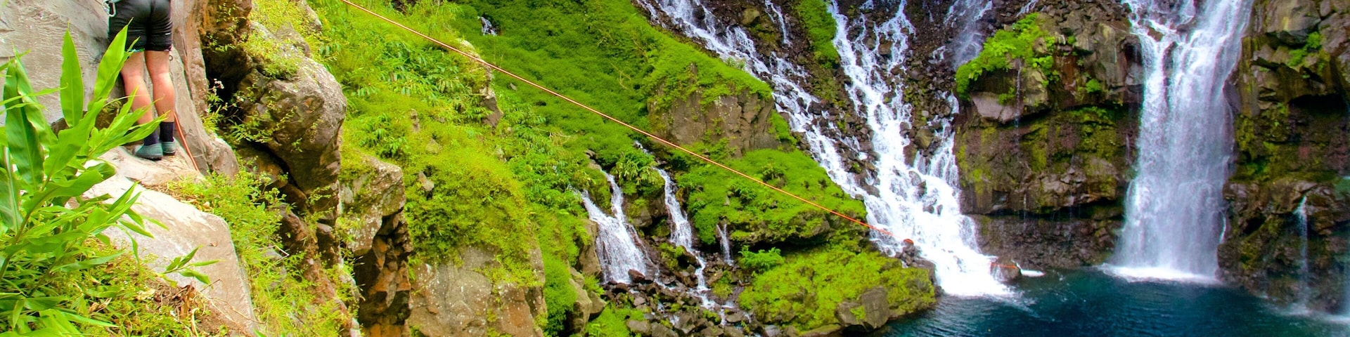 Grand Galet Falls featuring a lake or waterhole, zip lining and a cascade