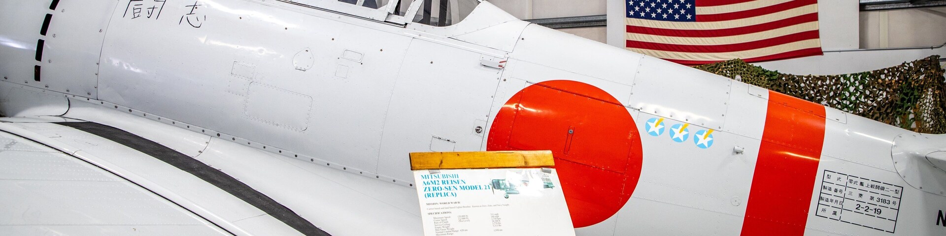 Olympic Flight Museum featuring aircraft, signage and military items