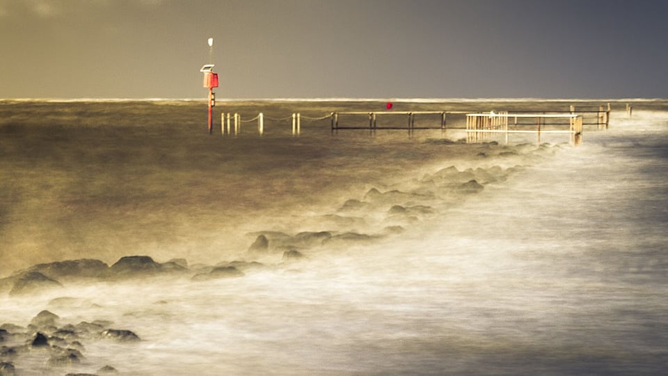 Taken on a very windy day on a fairly high tide. Must be mad.