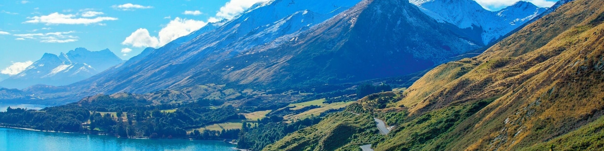 The drive from Queenstown to Glenorchy is by far my most favourite drive I've ever done, and it's gonna be really hard to beat that.
We were so lucky to visit Queenstown and Glenorchy in the middle of winter (June 2013, minus or 0 during the day, as crisp as you'd want your perfect winter to be) and have this absolute clear day with cracking blue skies.
The windy roads lead you through stunning green valleys, contrasted by clear blue lakes, majestic mountains topped with a crisp blanket of snow.