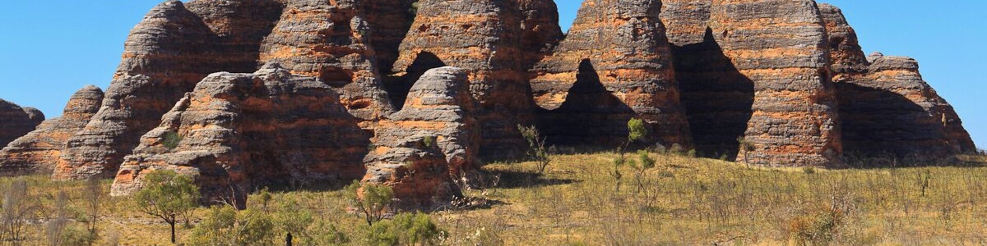 The Bungle Bungles in the Purnululu National Park is a UNESCO World Heritage Site.
The geology of the Bugle Bungles consits of sandstone domes. The layers of the sandstone domes have red and grey colours.
It's a stunning landscape and you can easily spend a few days hiking and exploring this place.