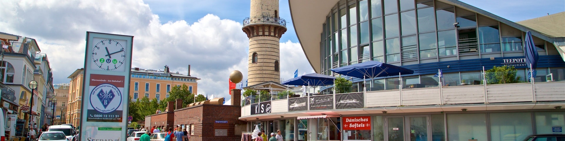 Warnemuende Lighthouse which includes signage, modern architecture and a lighthouse