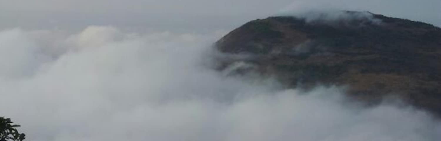 Floating clouds above Nandi hills. It is an ancient hill fortress in Souther India, approx 60 kilometers from the city of Bangalore. Its elevation is 4849 ft.