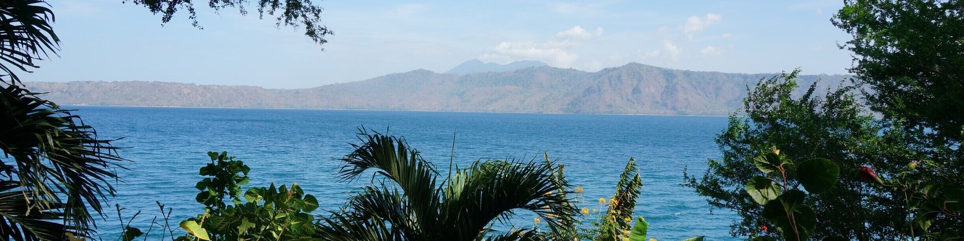 Laguna de Apoyo, a giant carter lake that formed after a volcano imploded on itself. You can see smoking Mombacho Volcano in the background.