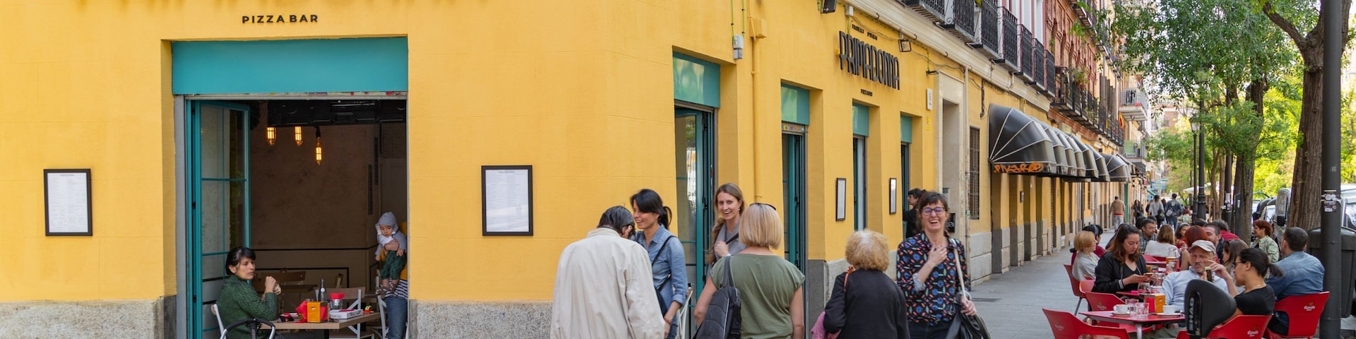 Lavapies which includes street scenes and signage as well as a small group of people