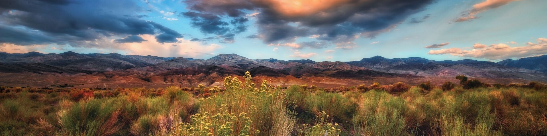 A beautiful evening amongst the sagebrush, White Mountains, and dramatic skies at sunset. Located just outside of Bishop on Owens river.