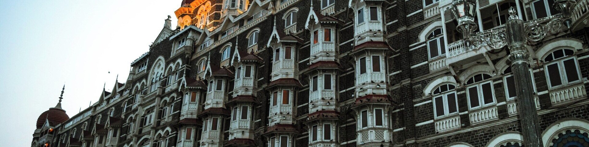 Tal Palace and Towers, my favourite place to stay in Mumbai - the heritage wing is particularly beautiful. The lights on the first floor are from Sea Lounge, an excellent tea place overlooking the Gateway of India and the ocean.