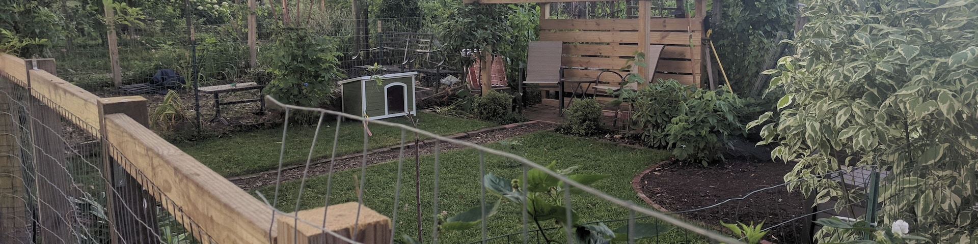 I love this garden! Not because of what is growing there but because of how some people are using the space. There aren't any yards around here so some people carve on out in the garden instead of planting veggies. Brilliant :)