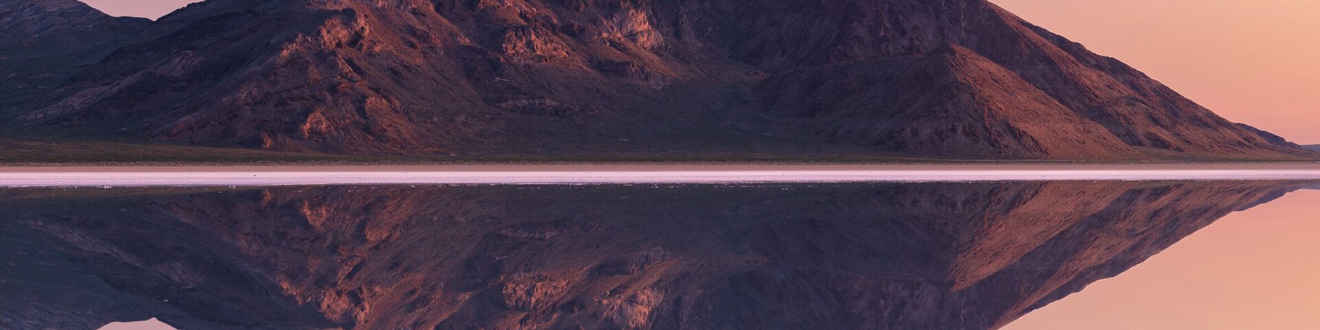 The sun rose and the mountains breathed in the warming morning air. There were still a few minutes of quiet calm before the wind woke up and the sky turned it's day blue.
