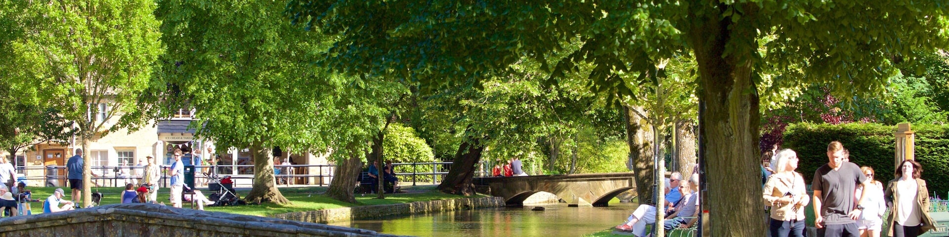 Bourton-on-Water featuring a garden, a bridge and a river or creek
