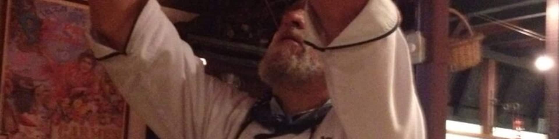 The owner of this Spanish restaurant, teaching us how to drink