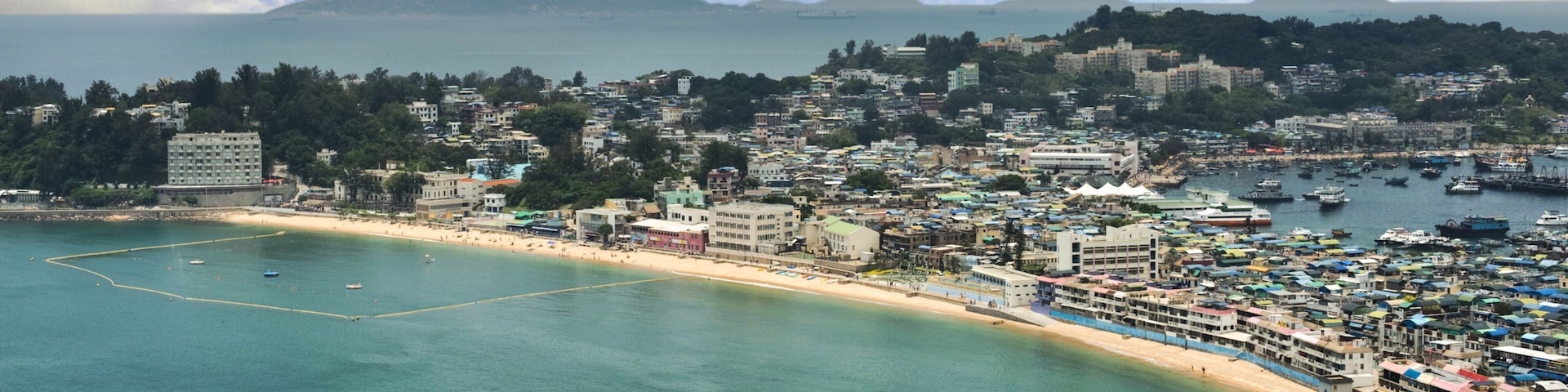 Cheung Chau which includes a coastal town and a bay or harbor
