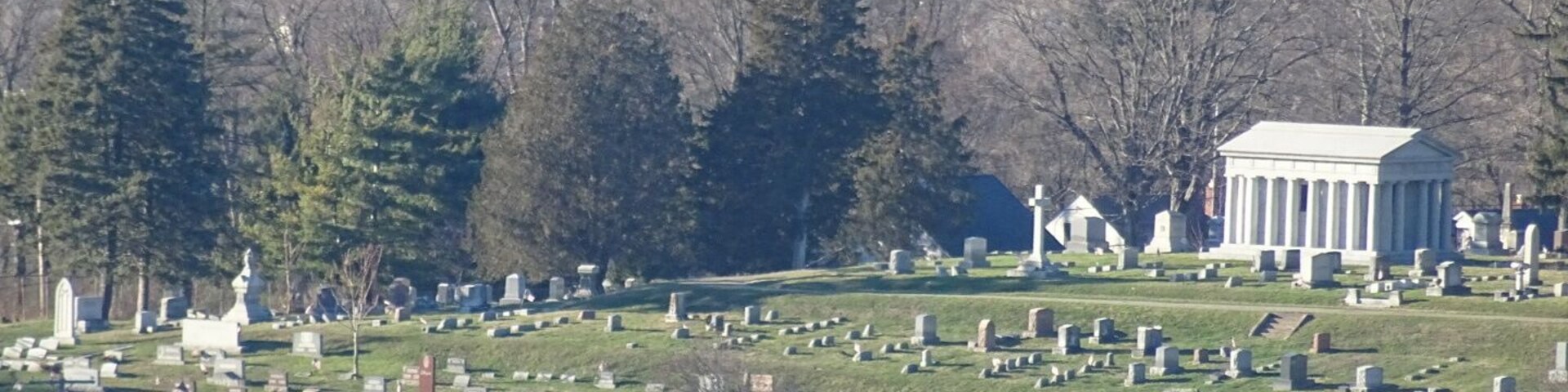 The view of Forest Rose Cemetery from Mt. Pleasant.
Rising 250-foot above the surrounding plain is a bluff known as “Mount Pleasant.” The bluff is made of highly erosion-resistant Blackhand sandstone. From the top of Mount Pleasant you have an exceptional view of the city and the forested hills at its outskirts.