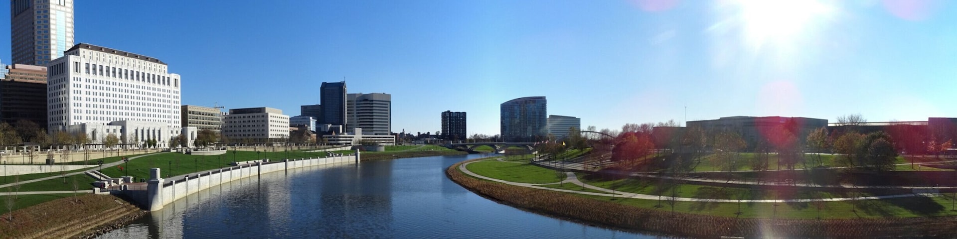 The view looking south from the Broad St. bridge showing the infill of new green space along the Scioto River.
The Scioto Greenways project consisted of three primary components: 
1) removing the Main Street Dam, 
2) restoring the Scioto River channel, 
3) creating 33 acres of new green space.