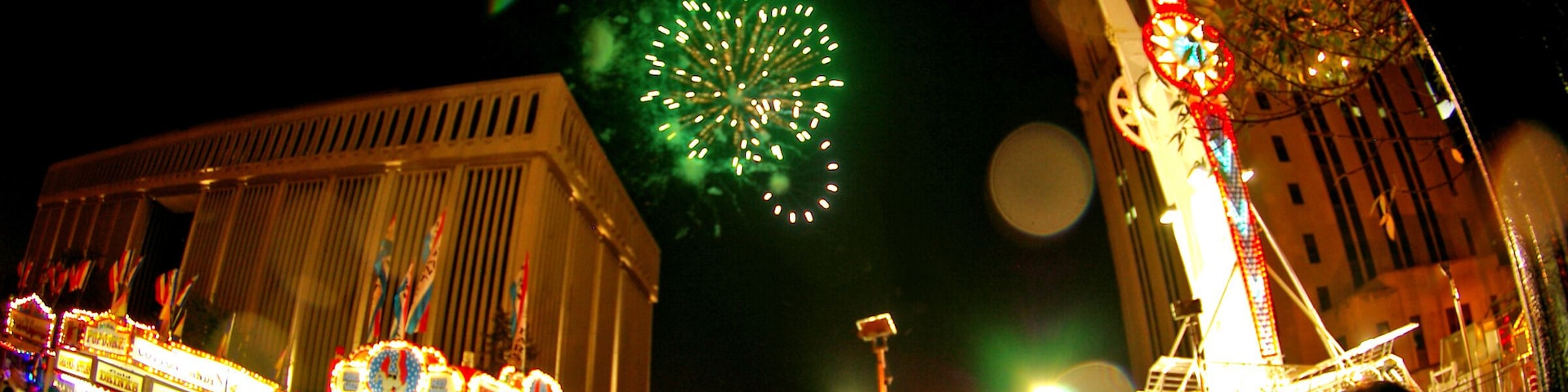 The city had a carnival. Had to use a fisheye lens to capture the whole scene. Love the fireworks.