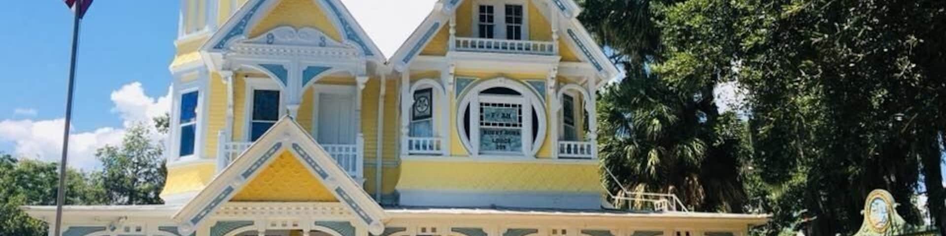 AKA The Donnelly House
John P. Donnelly came to Mount Dora in 1879 from Pittsburgh, PA. He married Annie McDonald Stone in 1881 and built this Queen Anne style house in 1893 as a gift to her. He was among the founders of the local yacht club, and served as the city´s first mayor in 1910. The Donnelly House, now owned by Mount Dora Lodge #238, F&AM, was listed in the National Register of Historic Places on April 4, 1975.
Mount Dora is a cute town on the banks of Lake Dora surrounded by antiquing opportunities and is just a short drive to the massive Renningers Antique Market